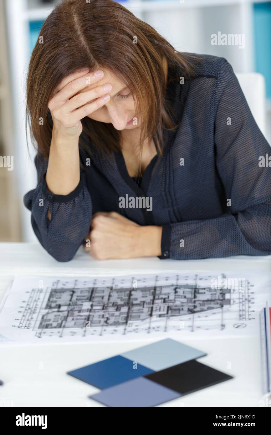 architect woman looking at plans Stock Photo - Alamy