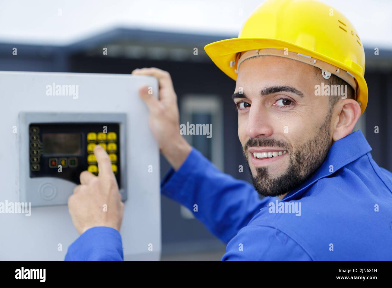 engineer operating a machine outdoors Stock Photo - Alamy