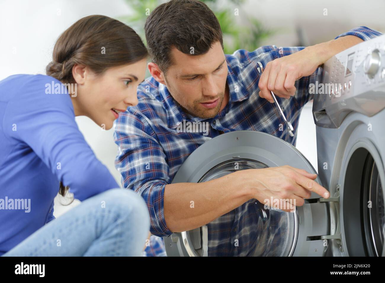 Broken washing machine hose hi-res stock photography and images - Alamy