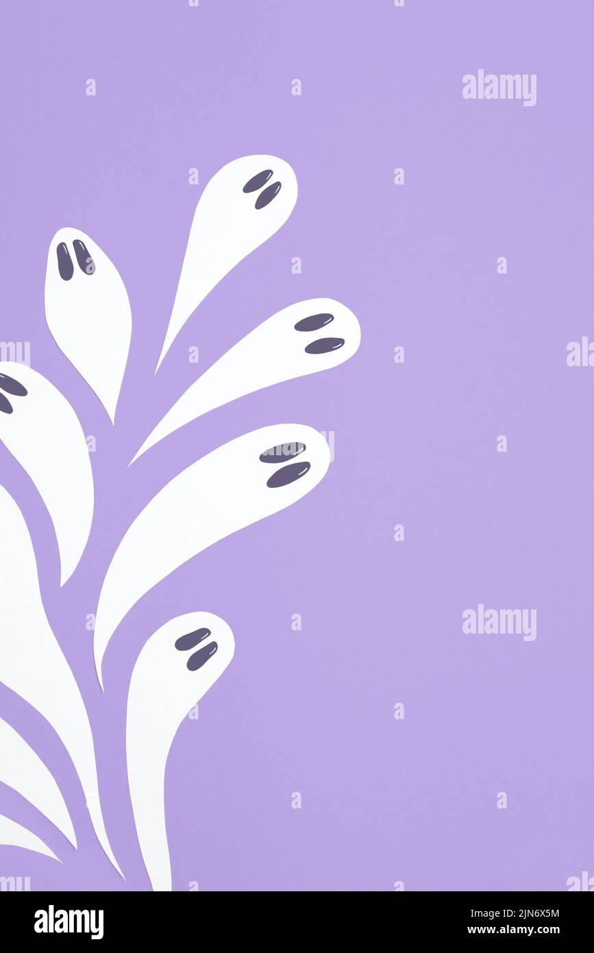 Halloween design, group of cute white ghosts flying on lilac background ...