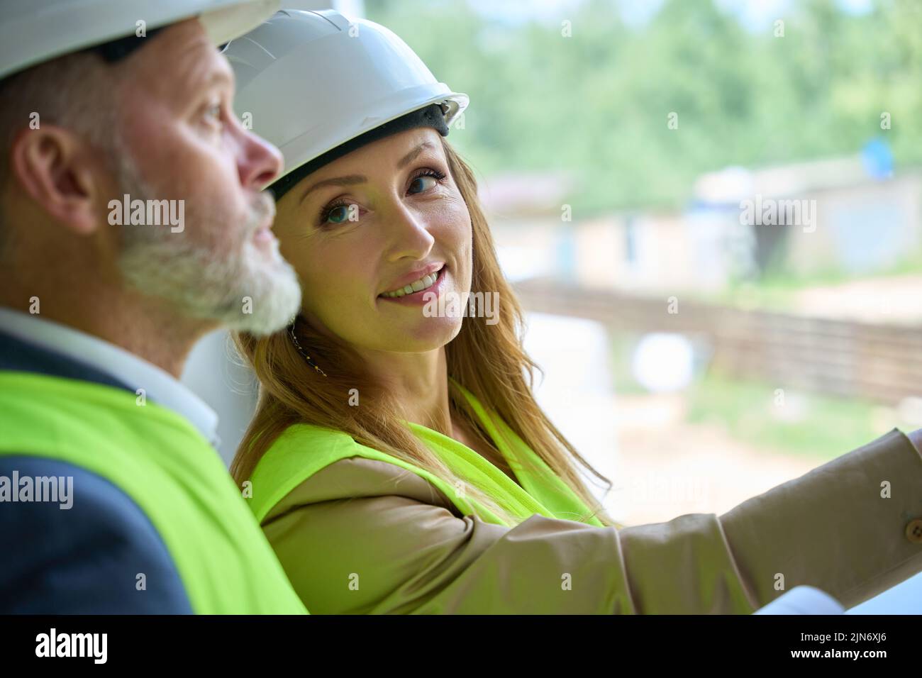 Close-up photo of faces of smiling female realtor and foreman Stock ...