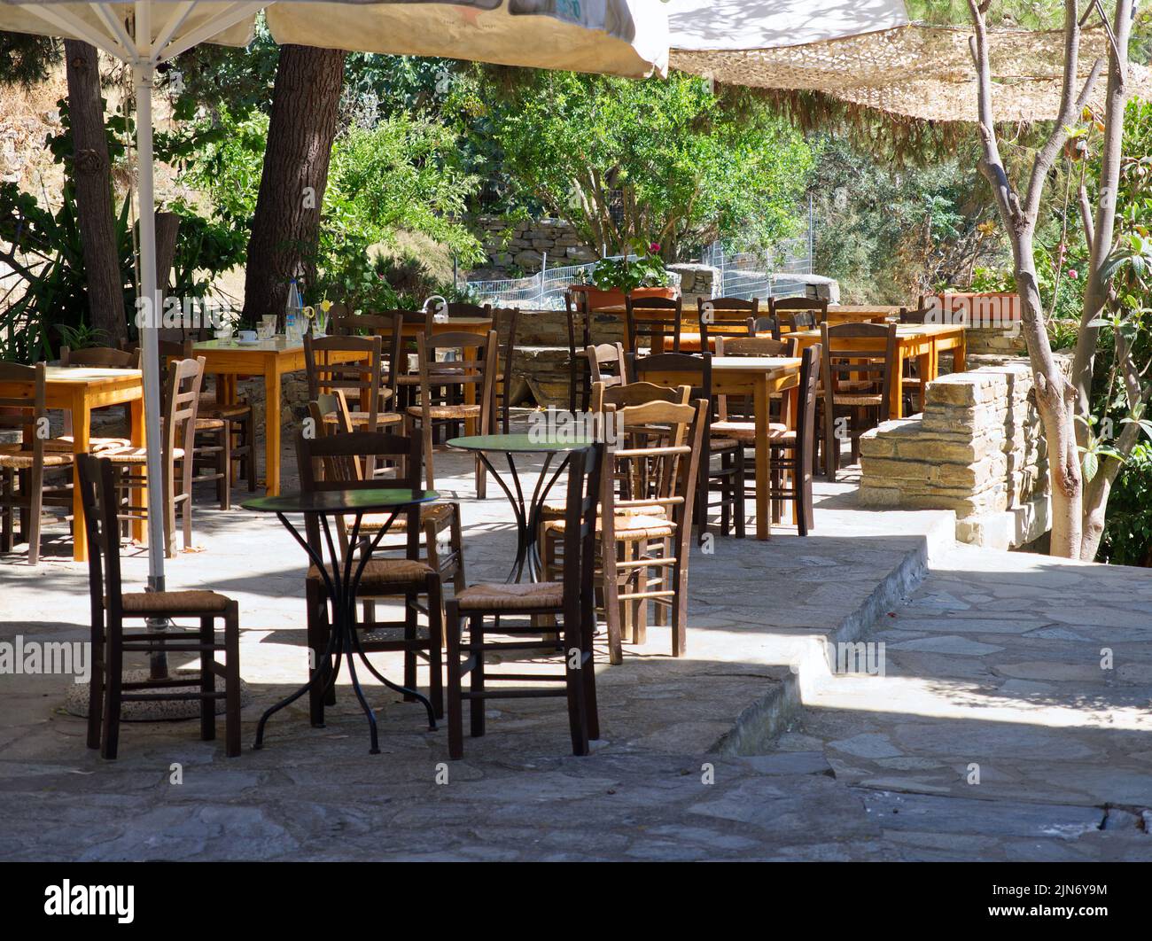 Cafe Square on cycladic island, Tinos Stock Photo - Alamy