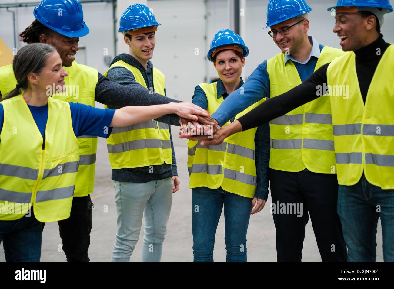 Group of robotics engineers unifying efforts and working together Stock ...