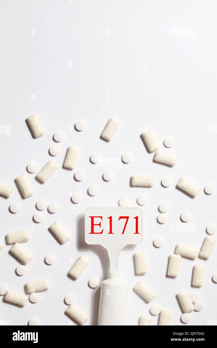 Titanium dioxide, E171, dangerous additive concept. gum, pills ...