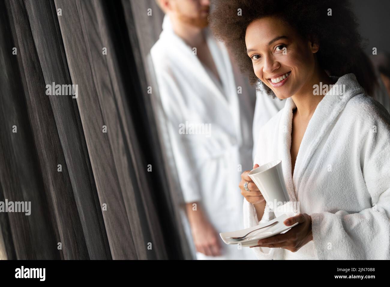 Woman wearing robe drinking coffee hi-res stock photography and images ...