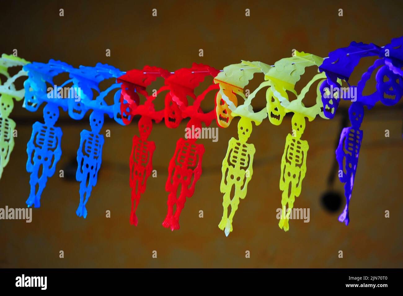 An elaborate and colorful sequence of skeleton-shaped decorations ...