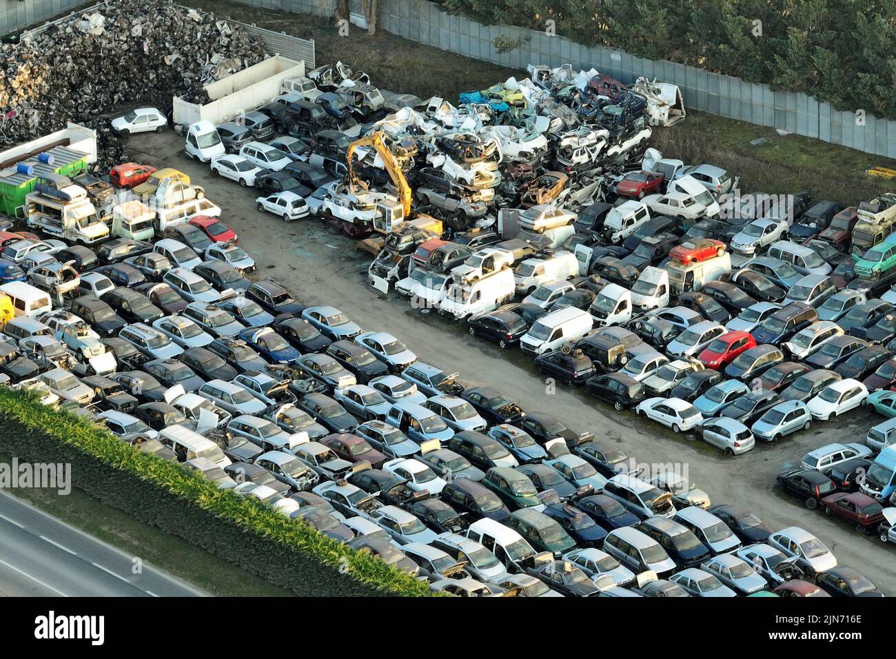 Aerial view of big parking lot of junkyard with rows of discarded ...
