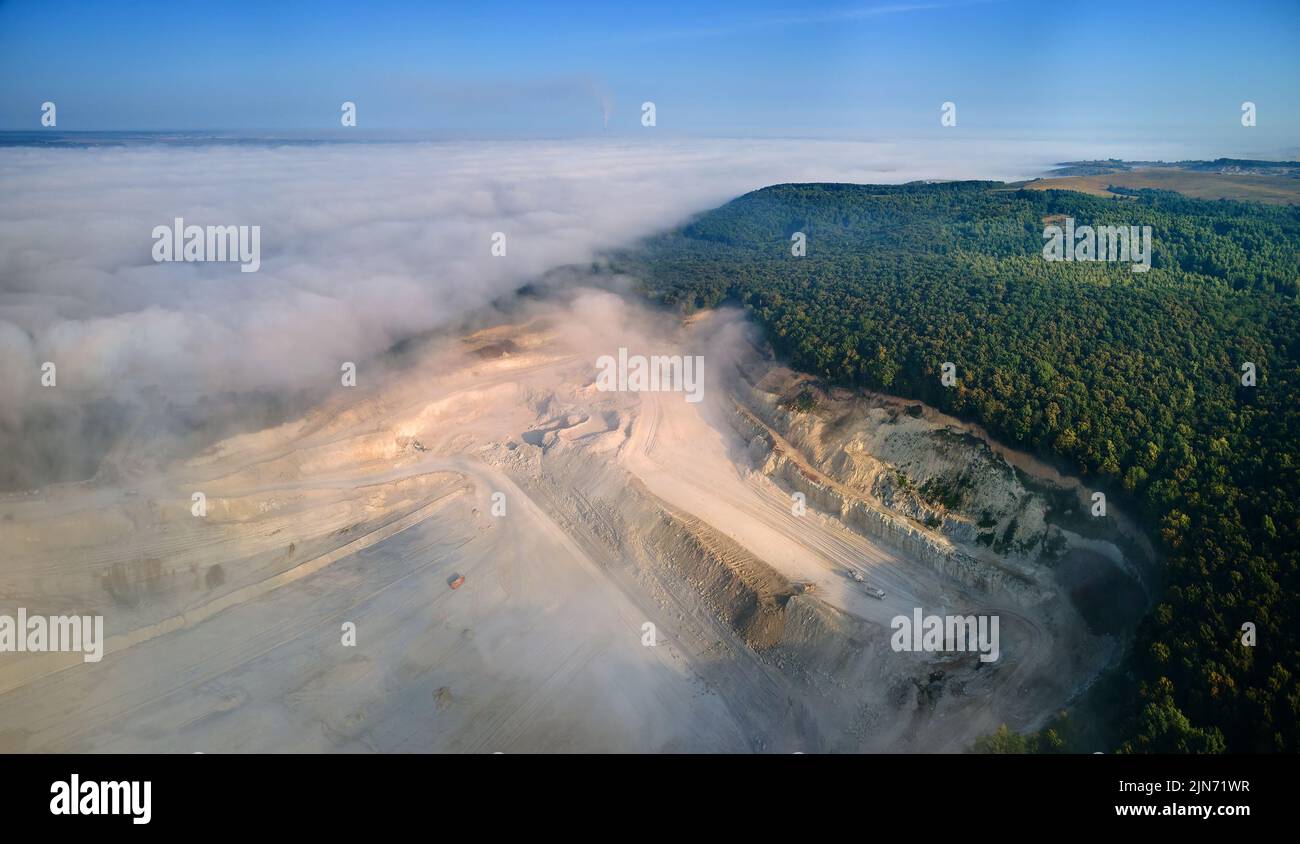 Aerial view of open pit mining site of limestone materials extraction ...