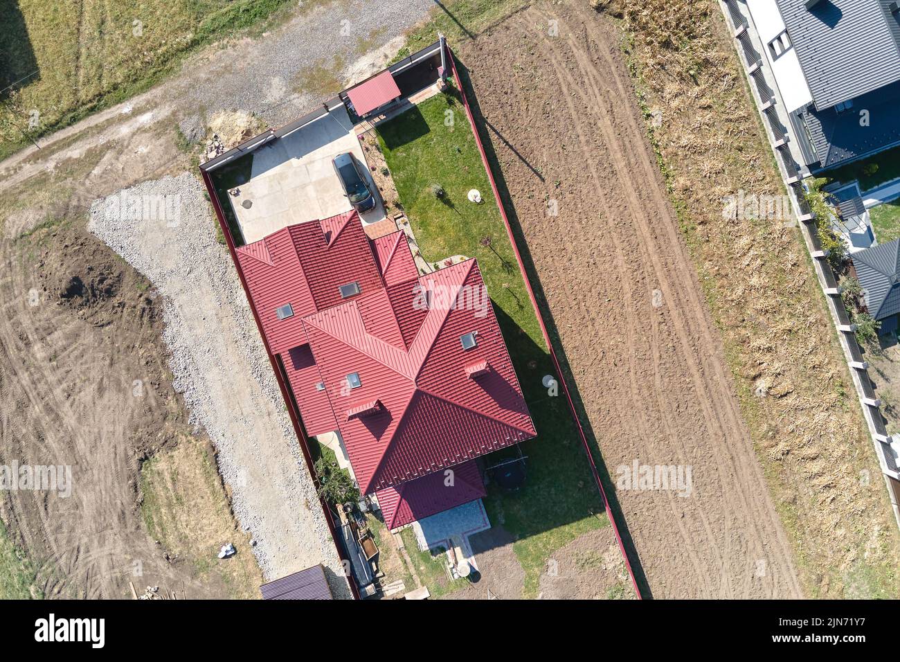 Aerial view of residential house with backyard in suburban rural area ...