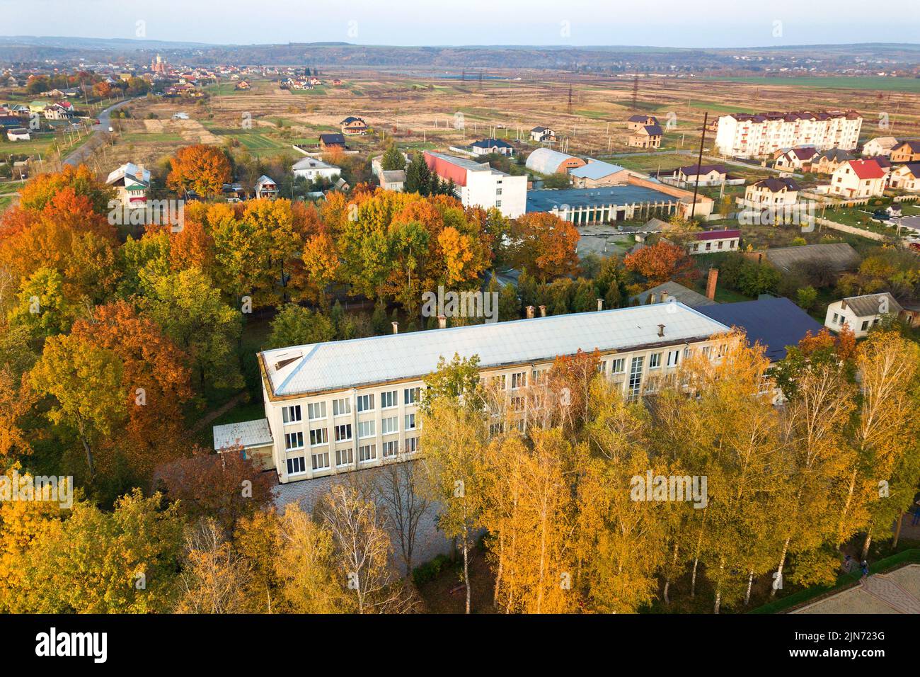 Aerial view of school, college or kindergarten building with big yard ...