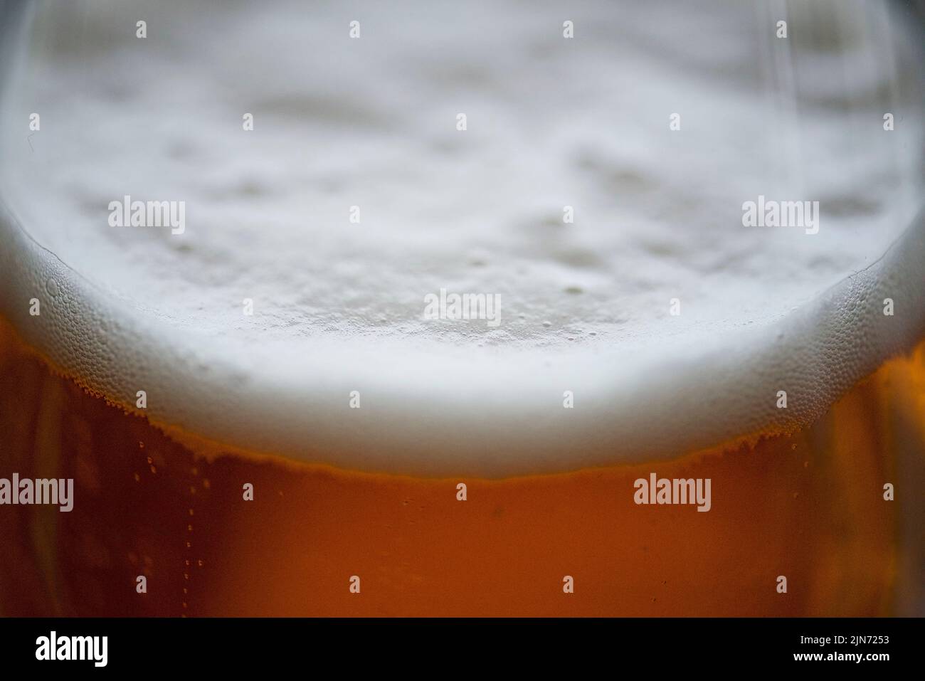Beer closeup with bubbles and foam, golden, light, drink, alcohol, pint ...