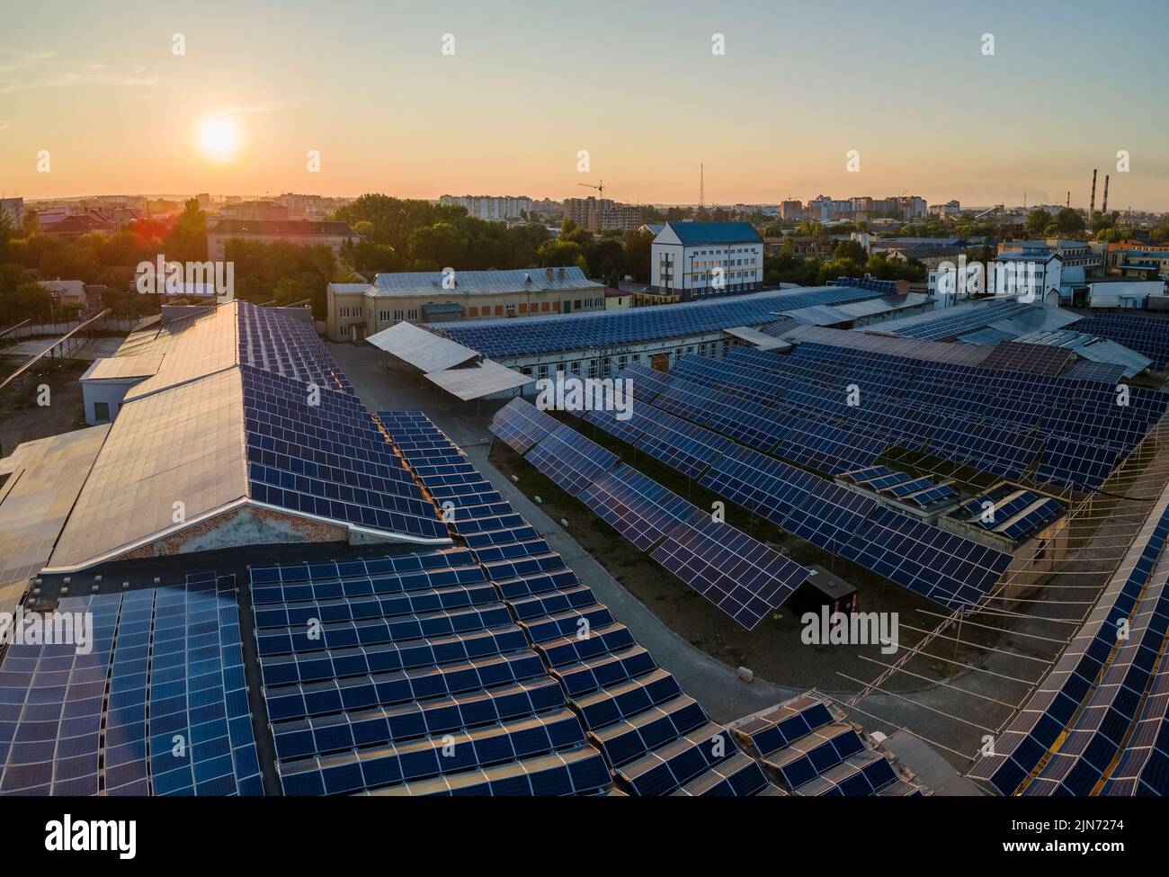 Aerial view of solar power plant with blue photovoltaic panels mounted ...