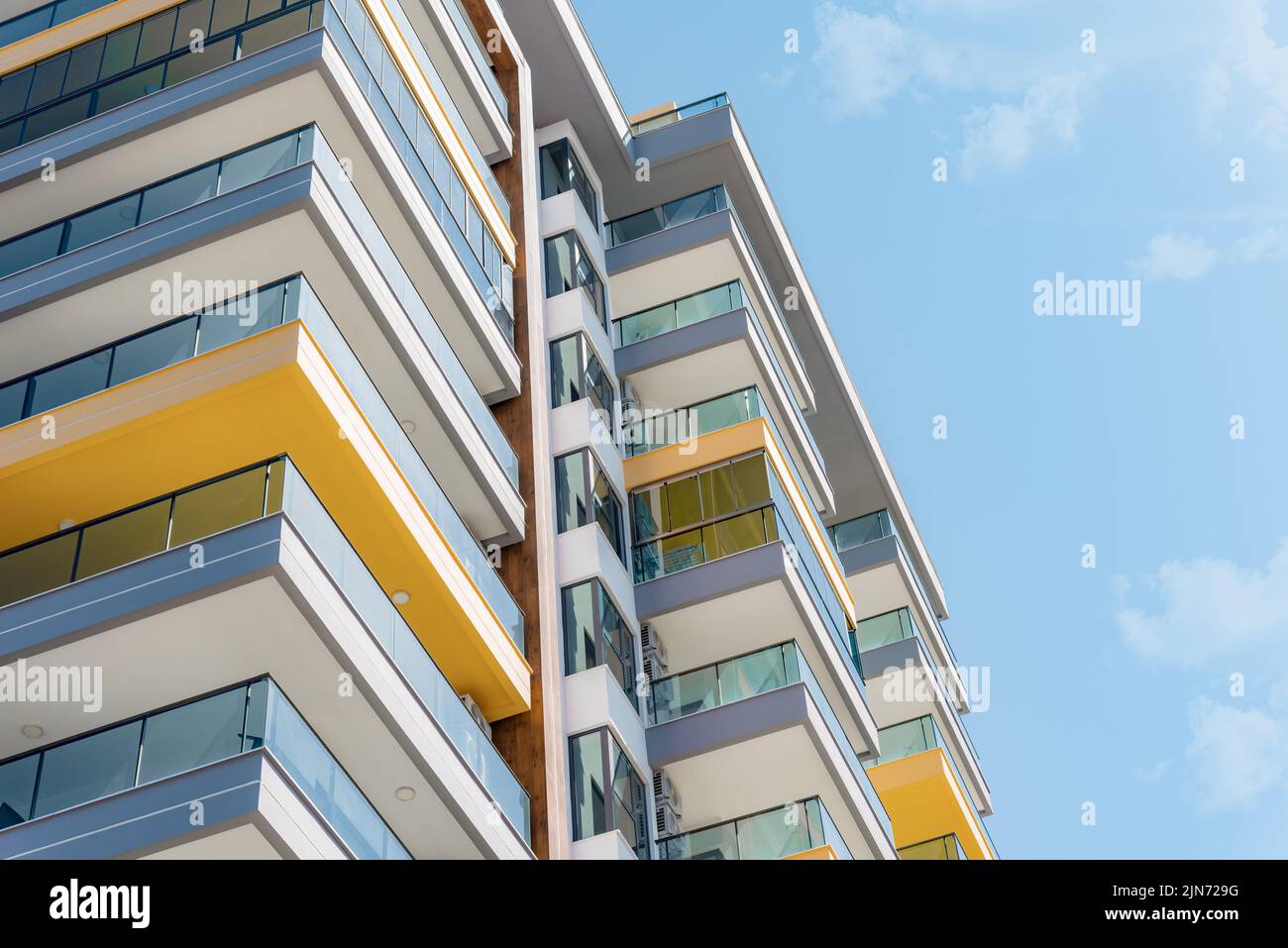 Part of a modern residential building with large balconies ...