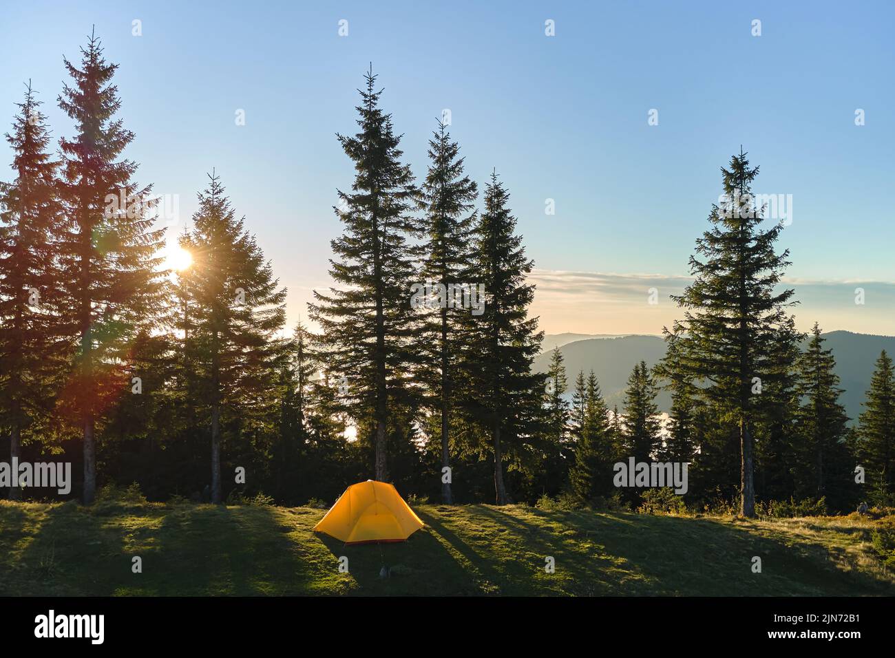 Aerial view of tourist camping tent on mountain campsite at bright ...