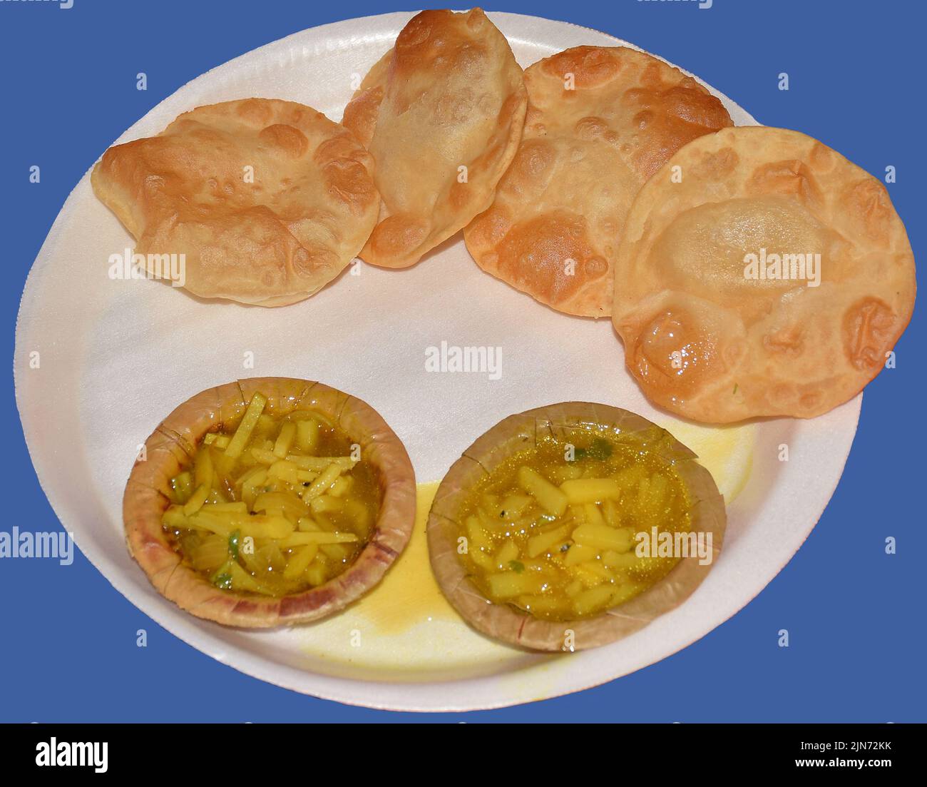 Bengali Puri with Aloo Subji served on a white plate Stock Photo - Alamy