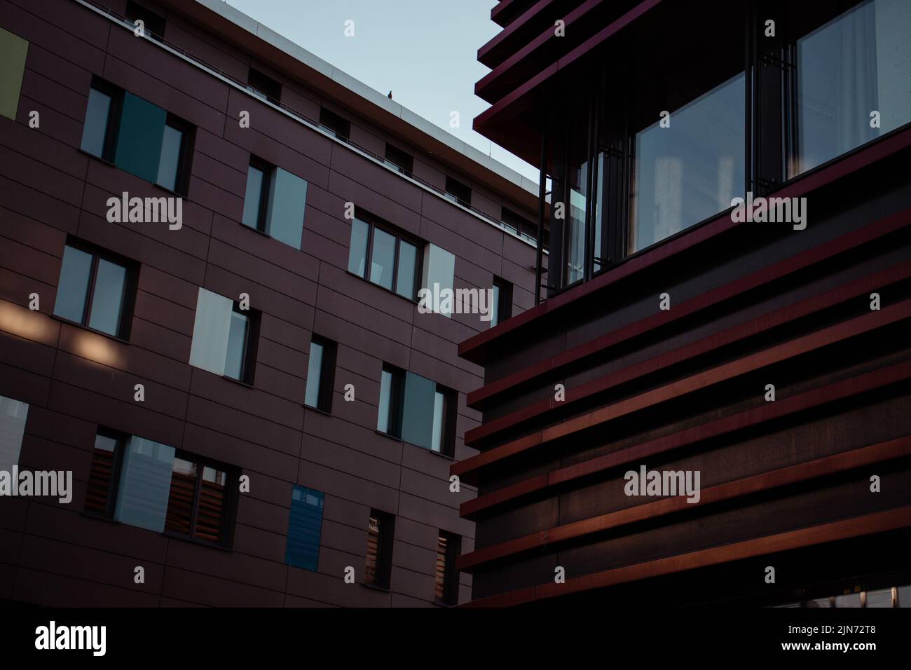 A magnificent shot of two lofty modern building facades neighboring one ...