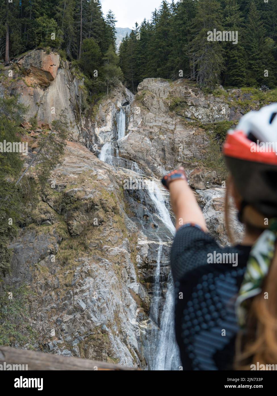A vertical shot of a female hiking in the mountains Stock Photo - Alamy