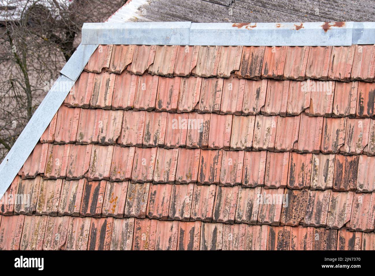 Closeup surface of old weathered ceramic tiles covering building roof ...