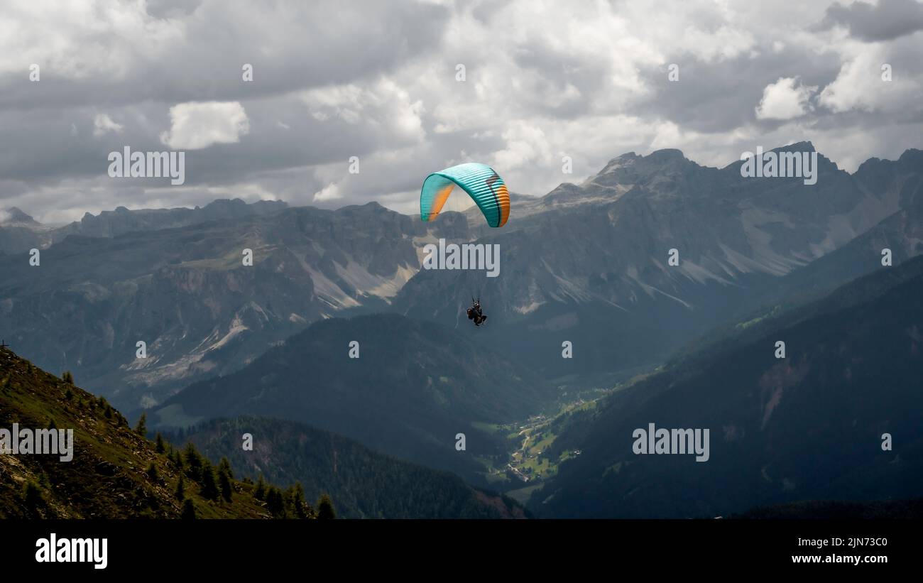 A paradglider in the Alps Stock Photo - Alamy