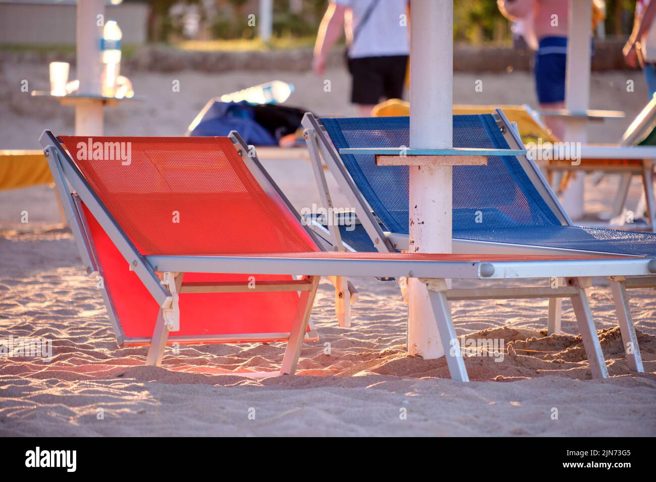 Empty deck chairs on sandy beach sea side in summer resort. Vacations ...