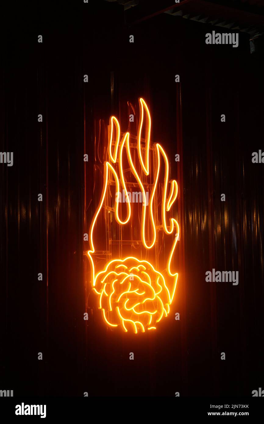 A vertical shot of the neon fire on the wall Stock Photo - Alamy