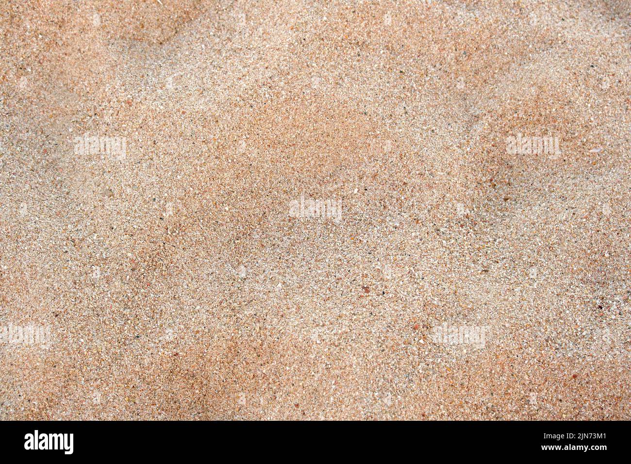 Flat view of clean yellow sand surface covering seaside beach. Sandy ...