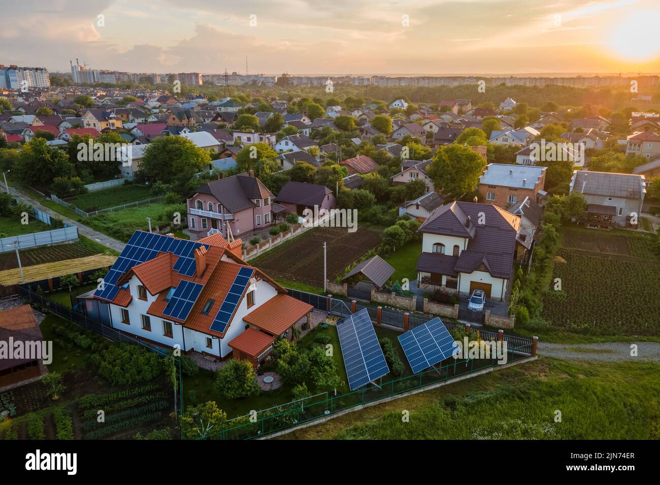 Residential house with rooftop covered with solar photovoltaic panels ...