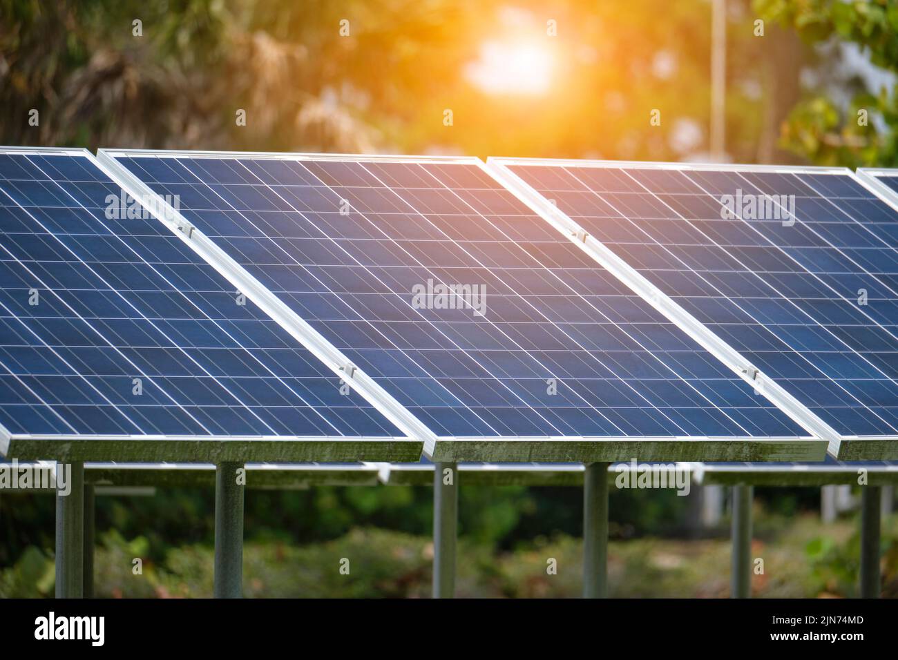Solar panels installed on stand frame near parking lot for effective ...