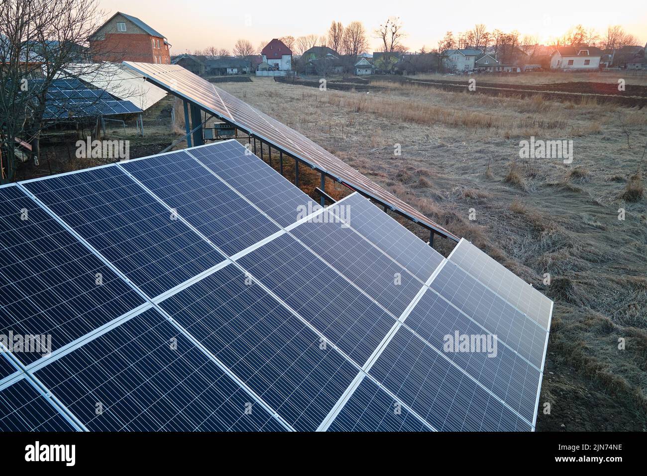 Solar photovoltaic panels mounted on stand-alone frame on backyard ...