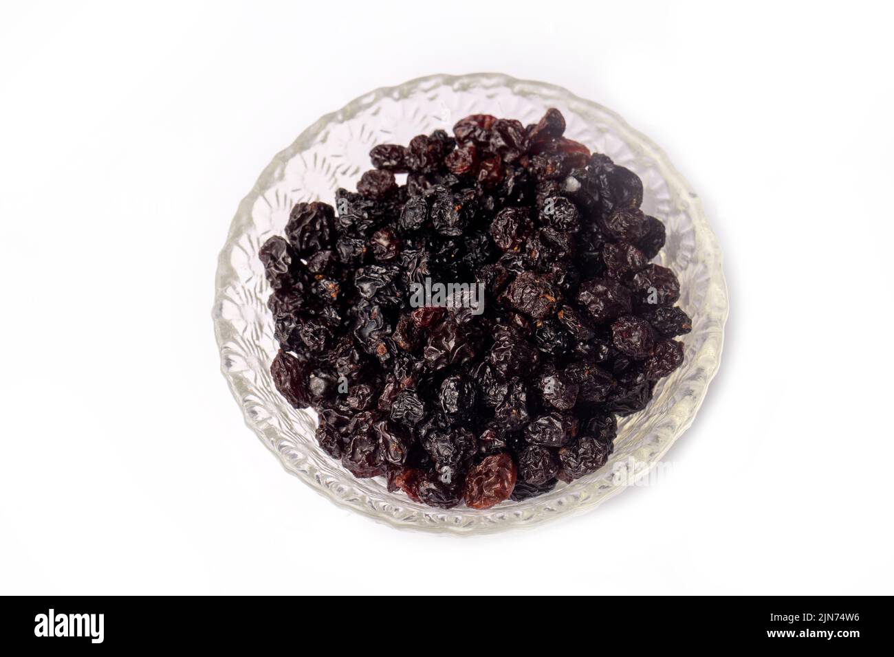 Dried currants on the white background Stock Photo - Alamy