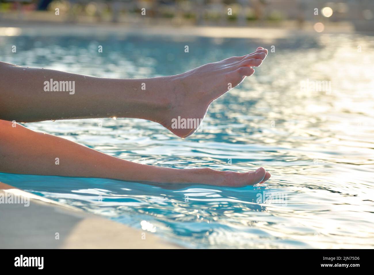 Legs sun lounger hi-res stock photography and images - Alamy