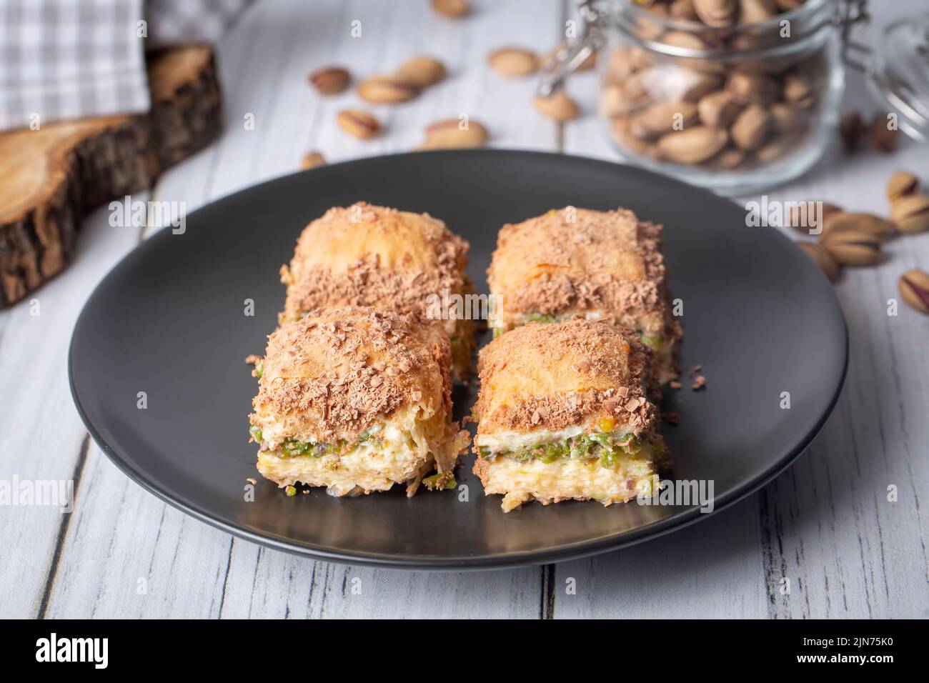 Traditional turkish new dessert cold milky baklava with pistachio ...