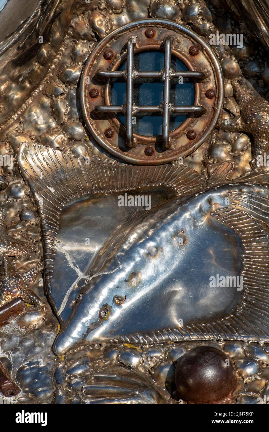 bronze or metal sculpture on a marine maritime or nautical scene with a ...