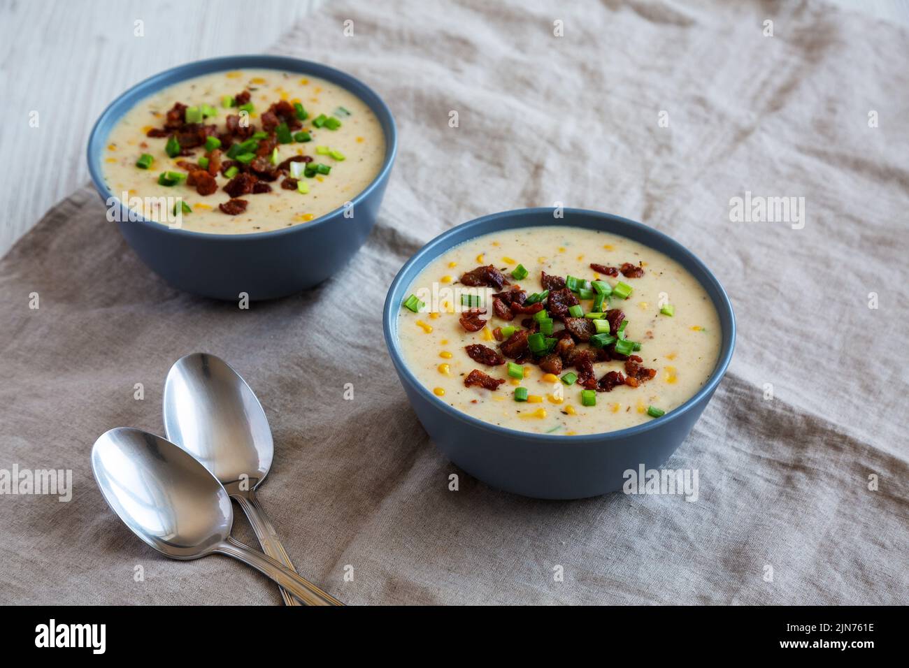 Homemade Corn Chowder with Bacon in Bowls, low angle view Stock Photo ...