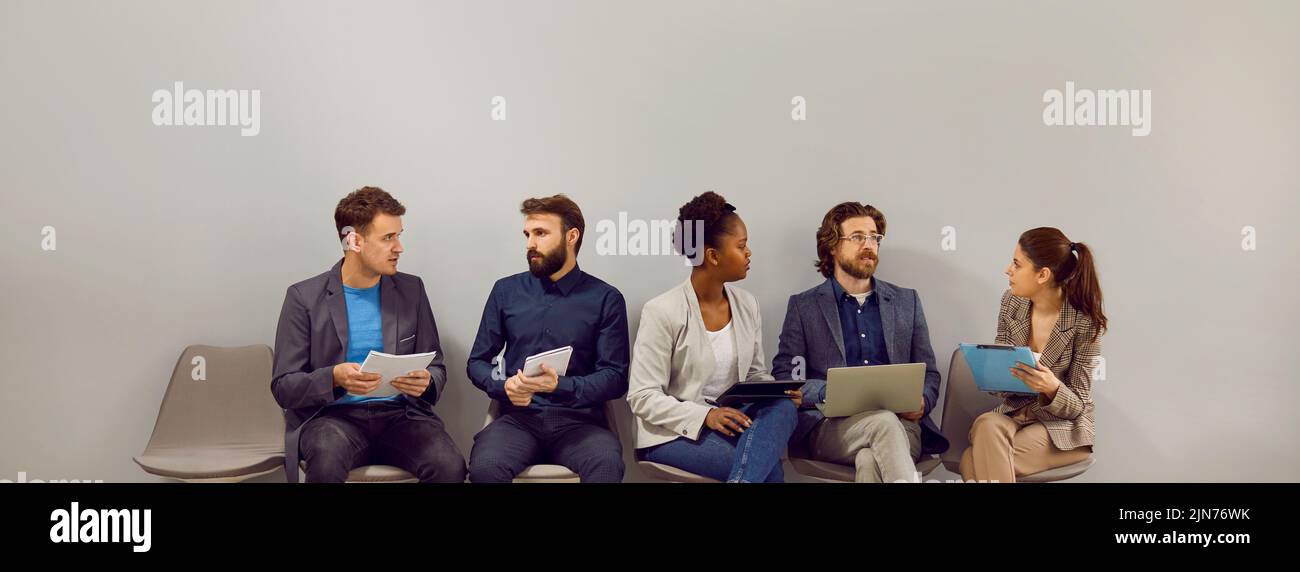 Multiracial people men and women waiting in line for interview at large ...