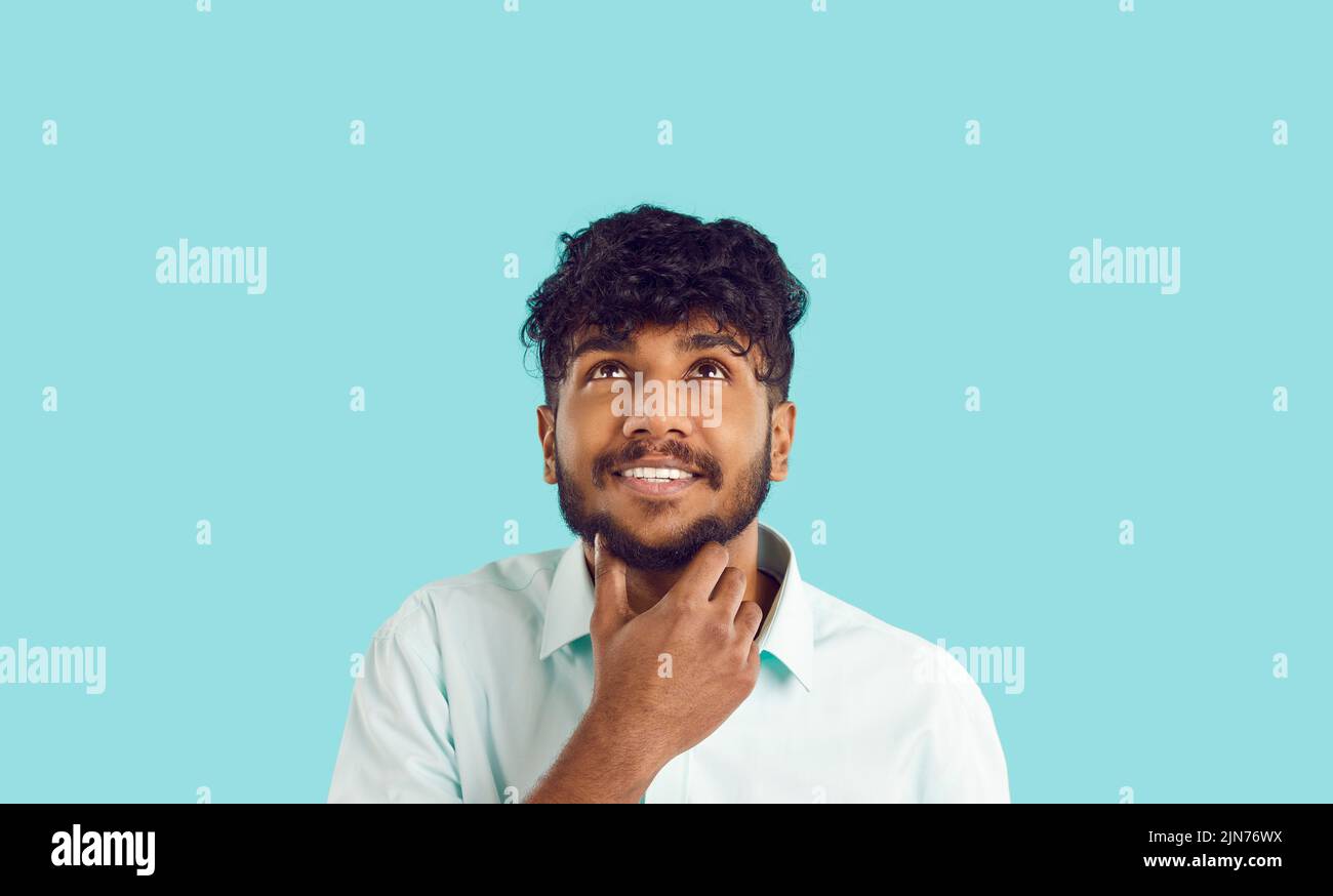 Happy indian man look up at copy space Stock Photo - Alamy