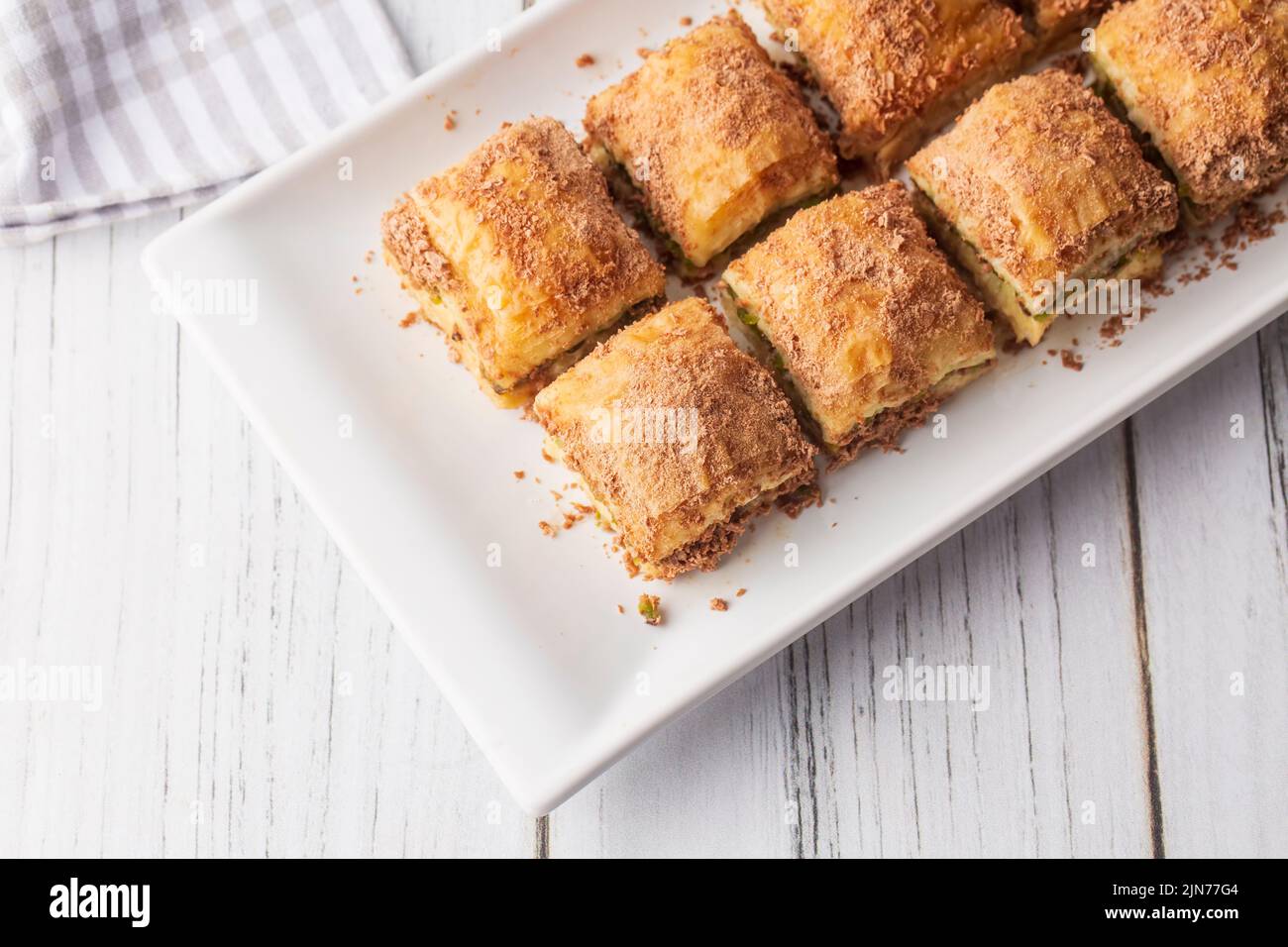 Traditional turkish new dessert cold milky baklava with pistachio ...