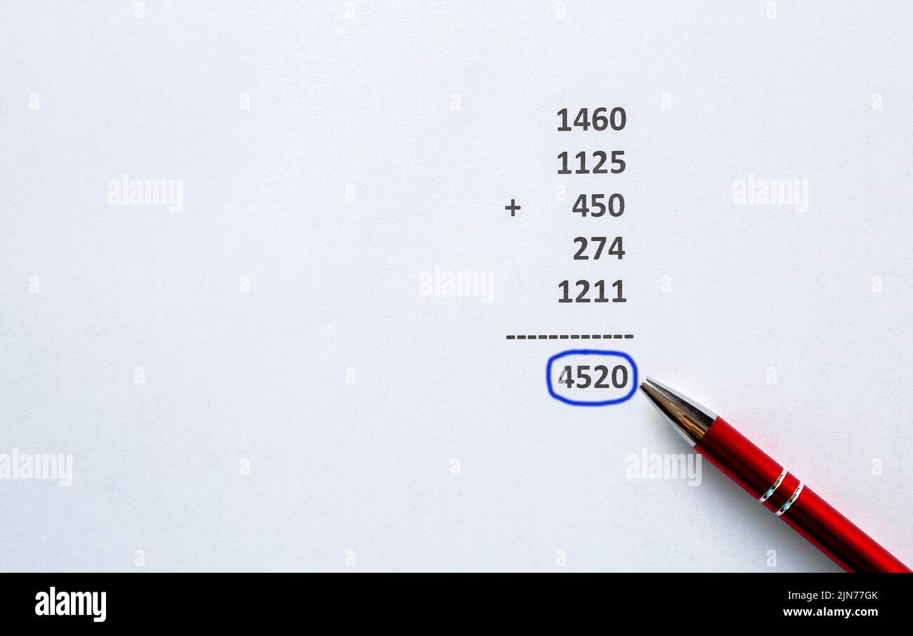 Difficult calculations on a white sheet of paper Stock Photo - Alamy