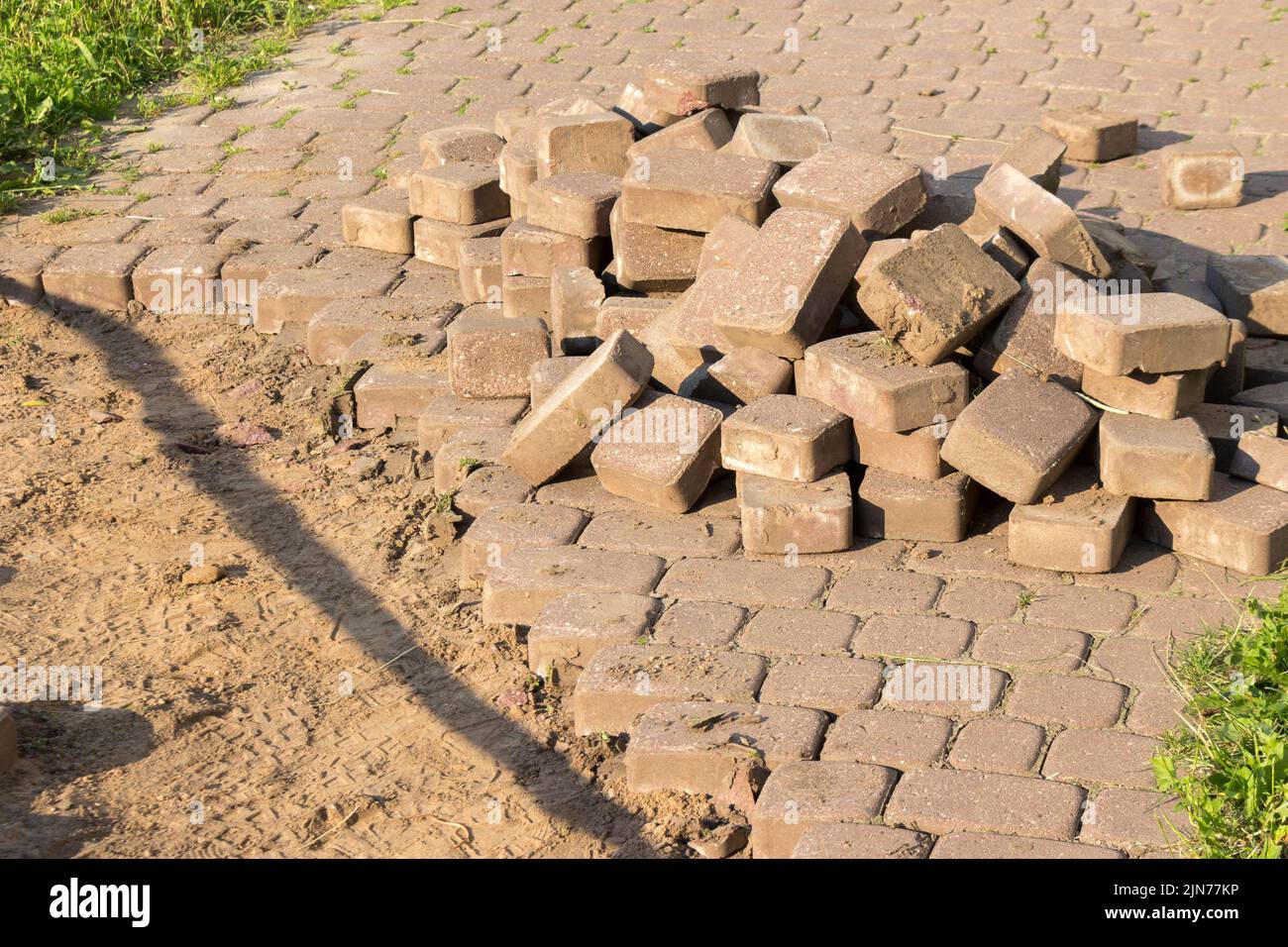 Road repair. Broken asphalt on pedestrian zone in the city street. Road ...