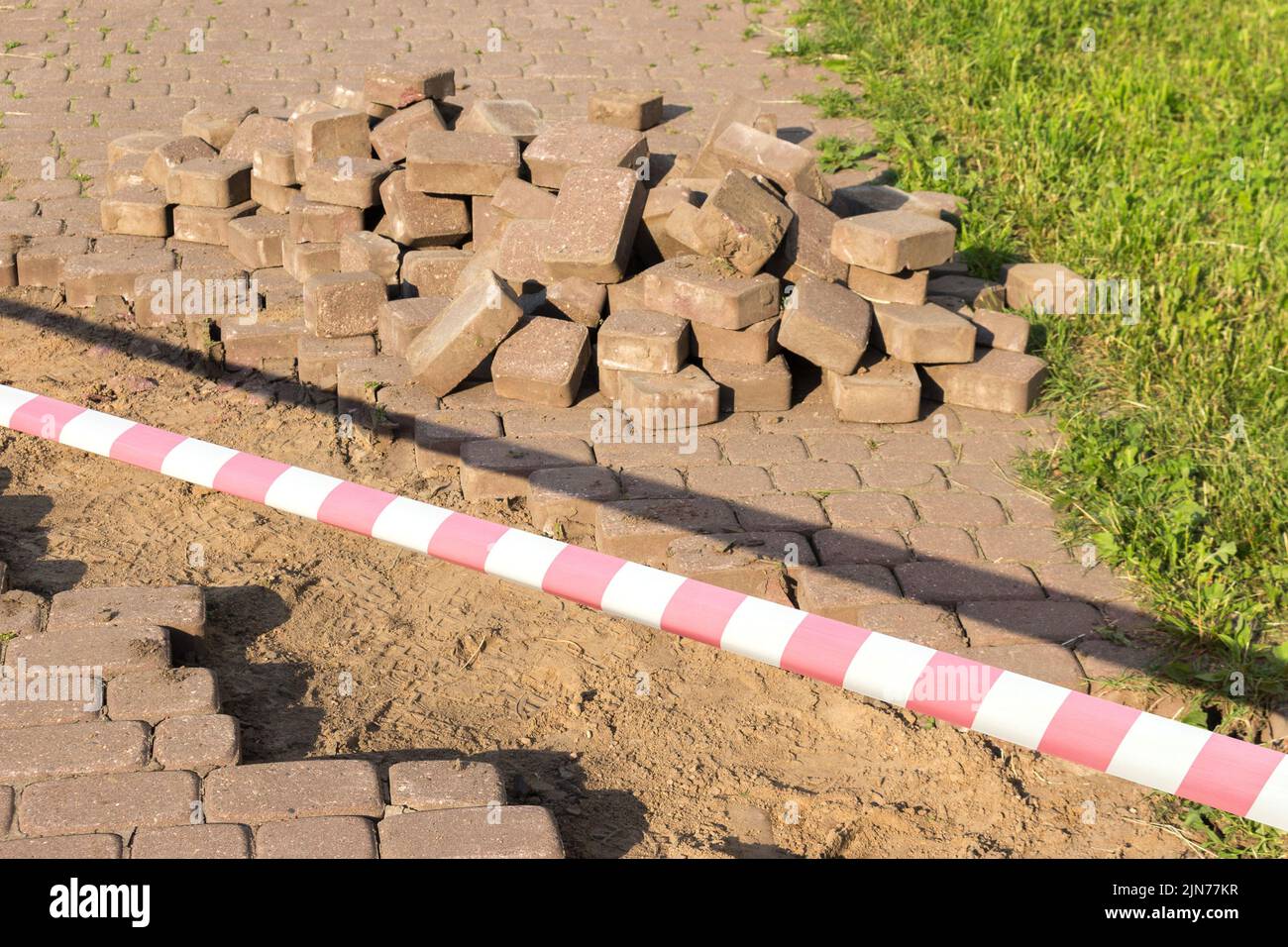 Road repair. Broken asphalt on pedestrian zone in the city street. Road ...
