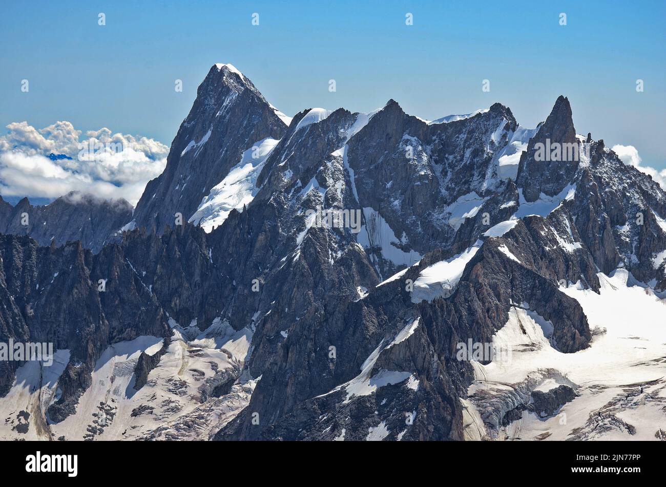 A scenic aerial shot of the Mont Blanc mountain in the Alps covered in ...