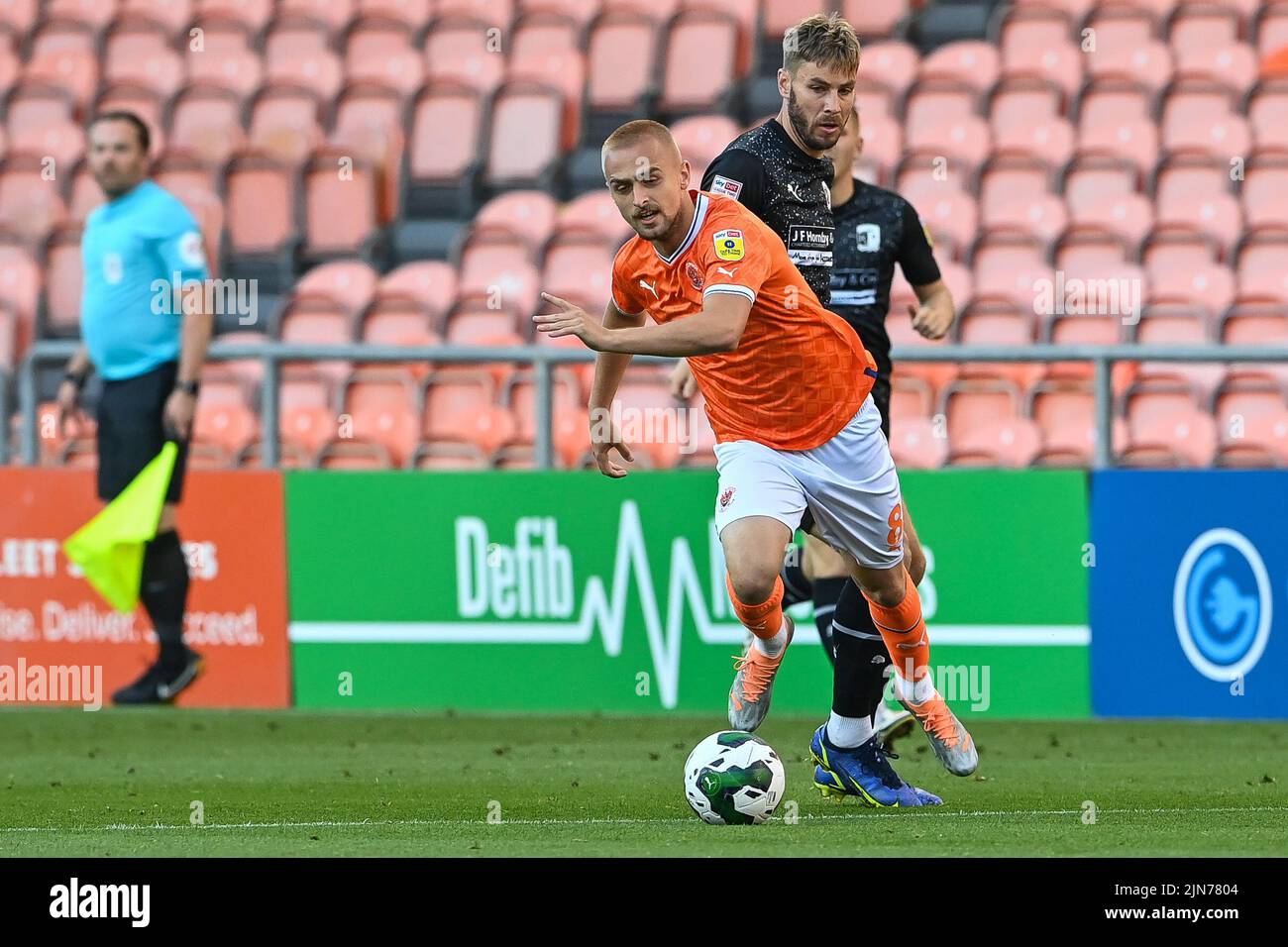 Lewis Fiorini #8 of Blackpool in action Sam Foley #16 of Barrow Stock ...