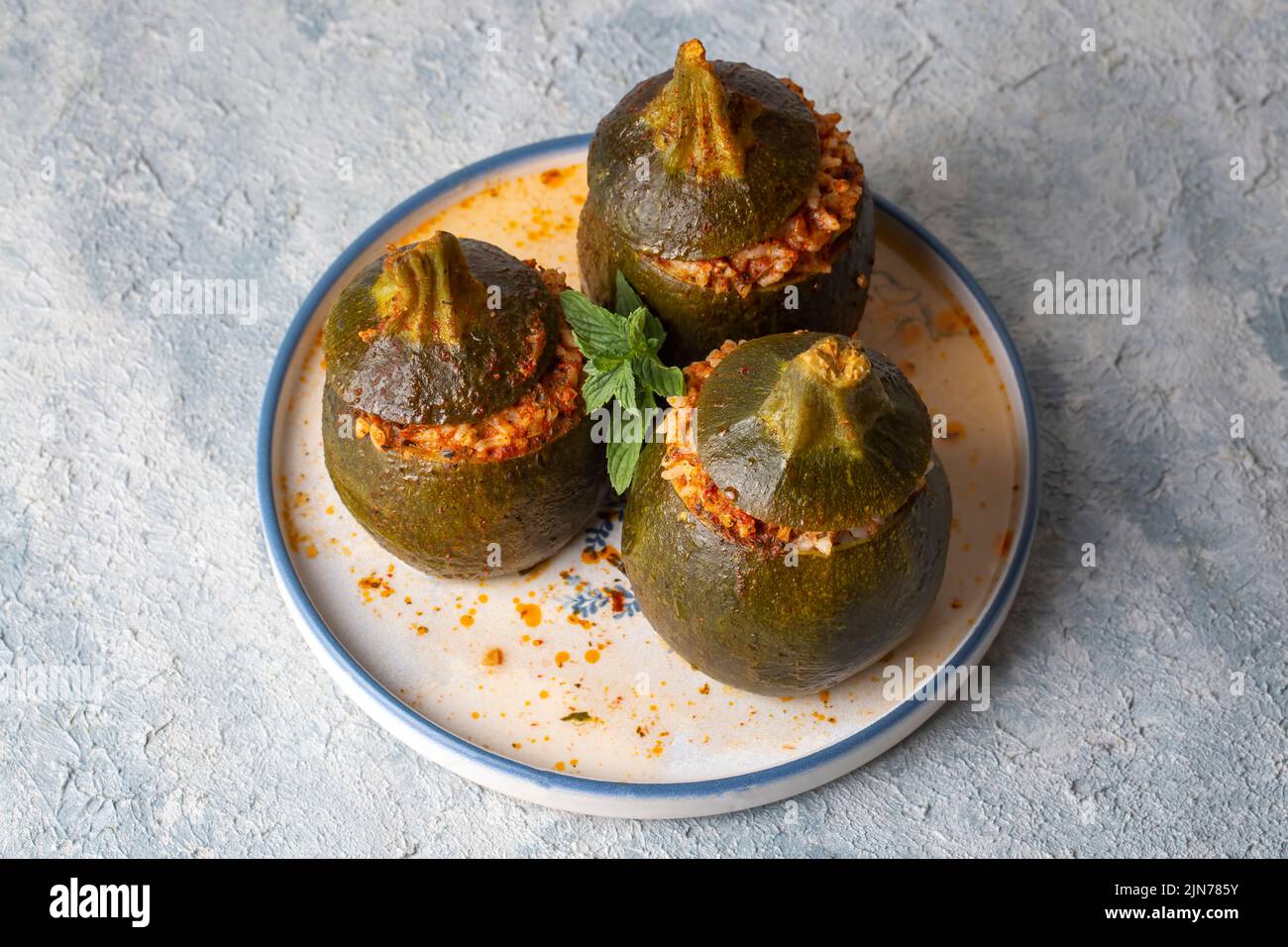 Zucchini stuffed with meat, rice and vegetables. Traditional delicious ...