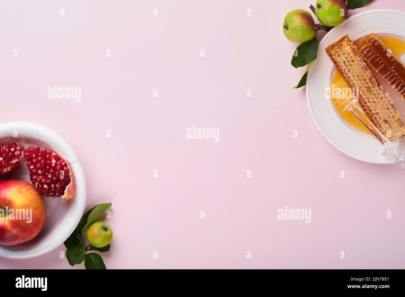 Rosh Hashanah. Honey jar, honeycomb, apple and pomegranate on simple ...