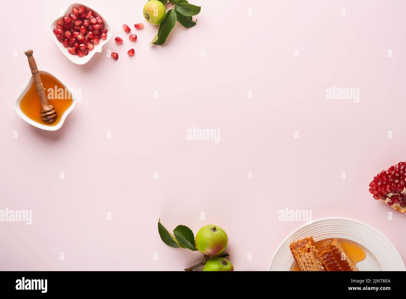 Rosh Hashanah. Honey jar, honeycomb, apple and pomegranate on simple ...
