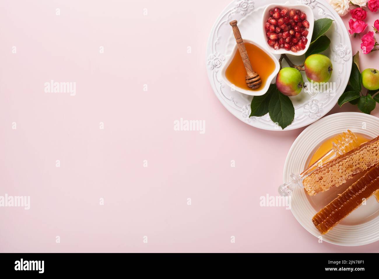 Rosh Hashanah. Honey jar, honeycomb, apple and pomegranate on simple ...