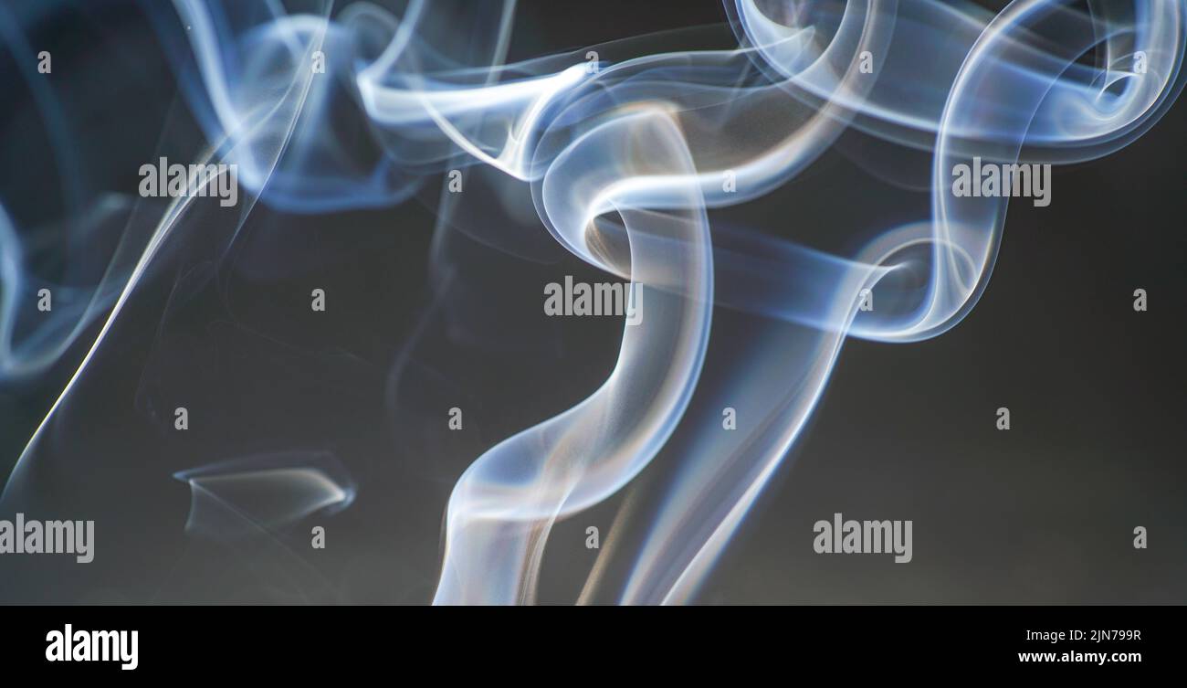 Smoke photographed in the studio with copy space and effect background ...