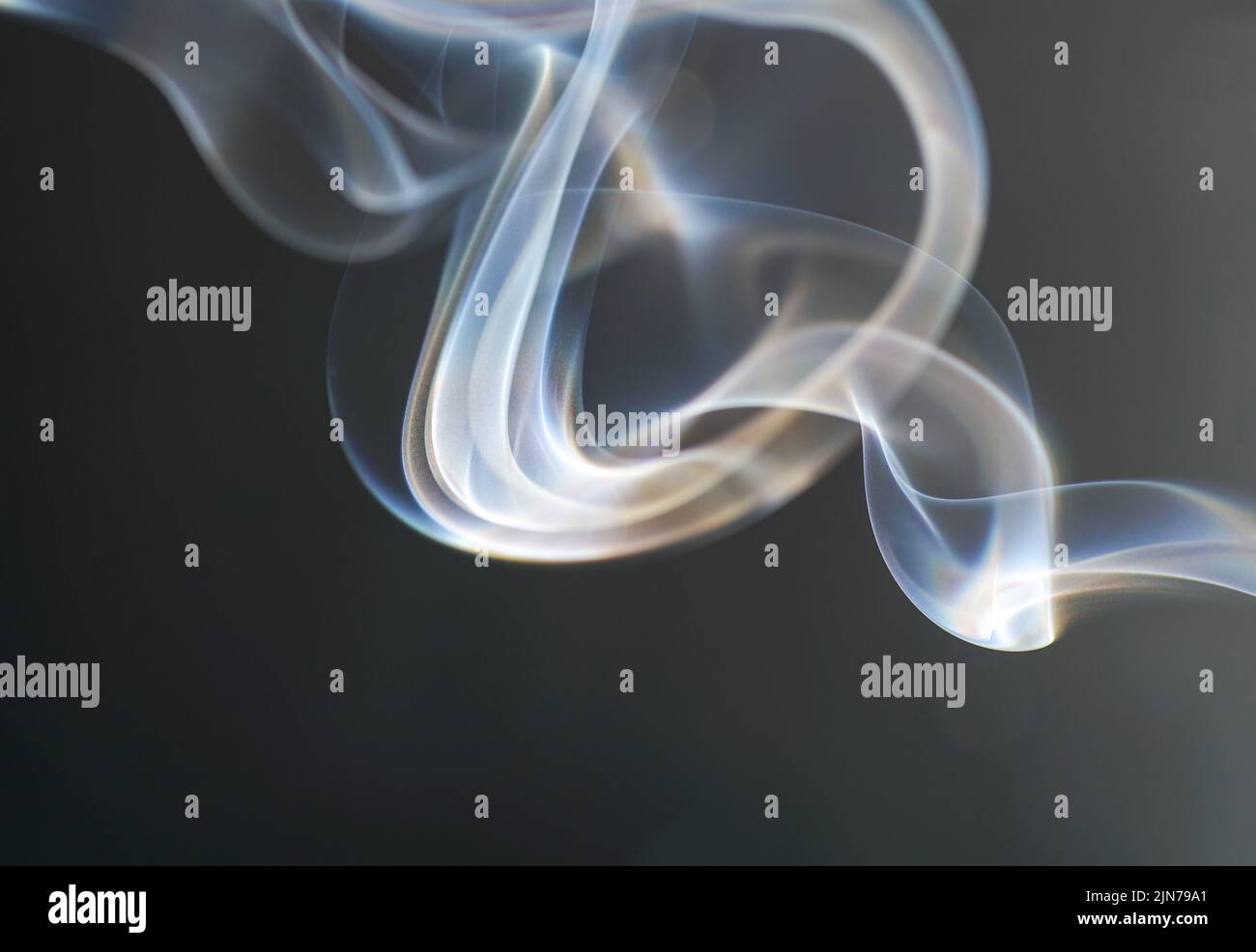 Smoke photographed in the studio with copy space and effect background ...
