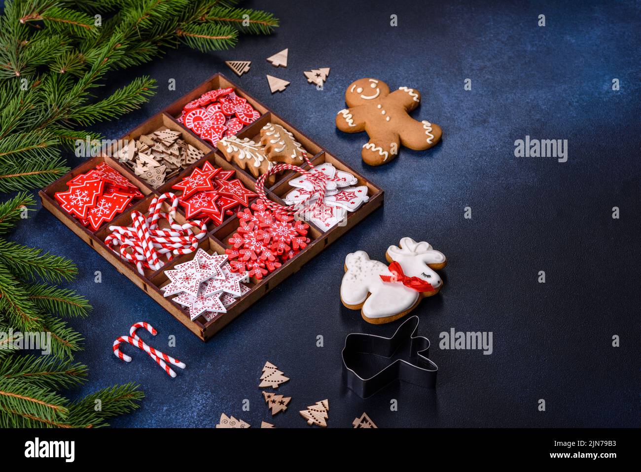 Christmas toys in white and red in a wooden sectional box against a ...