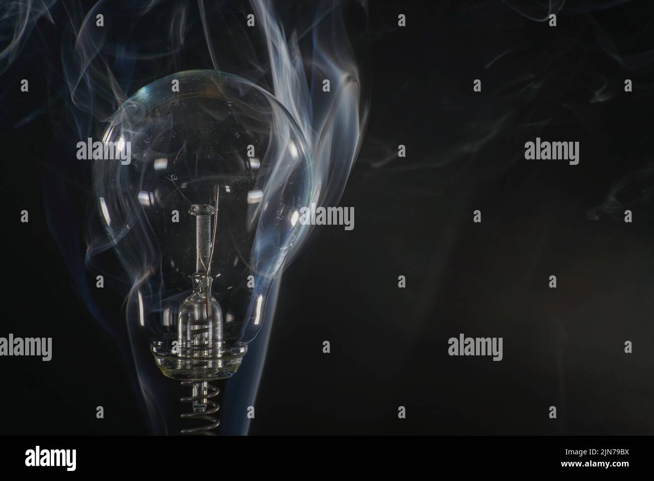 Smoke photographed in the studio with copy space and effect background ...